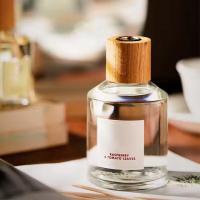 China Customized round spiral wood cover glass bottle aromatic reed diffuser sustainable packaging for sale