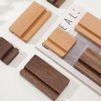 China Wood Cell Phone Stand Wooden Mobile Phone Holder Universal Portable Desktop Smartphone Stand for sale