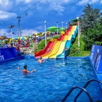China ODM Outdoor Large Water Amusement Park Summer Swimming Pool Fiberglass Rainbow Slide For Children for sale