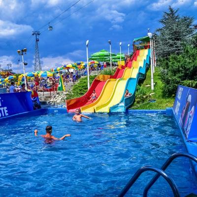 China ODM Outdoor Large Water Amusement Park Summer Swimming Pool Fiberglass Rainbow Slide For Children for sale