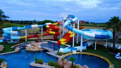 China Swimming Pool Water Play Equipment Fiberglass Water Slide For Adults for sale