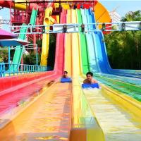 China Fiberglass Rainbow Racing Slide Water Park Equipment Swimming Pool Slide Over 3 Lane For Adult Water Game 100KG Capacity for sale