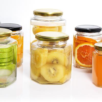 China Food Grade Empty Clear Hexagonal Square Glass Empty Food Storage Jars for sale