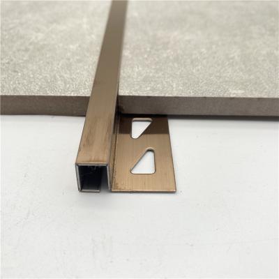 China Tile And Floor Accessories Profile Corner Ceramic T Shaped Stainless Steel Tile Trim for sale