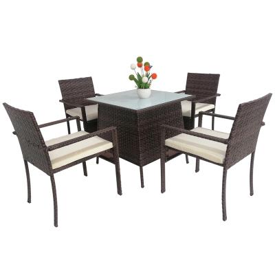China Factory 2027 Hot Sale 1 Piece Table 4 Pieces Chairs  Garden Rattan Dining Set Tempered Glass Table Top for sale