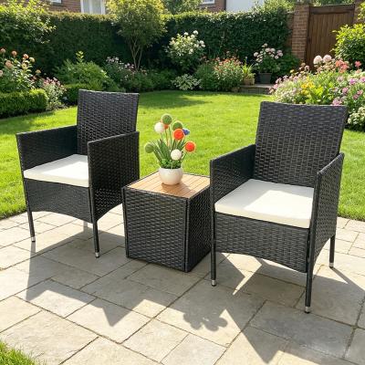 China Outdoor Patio Garden Wicker Rattan Chair Conversation Set with Cushion 3 Piece Set Teak Table and Black Chair Bistro Set for sale