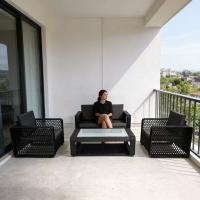 China Modern Black PE Rattan Outdoor Sofa Set with Glass Coffee Table for Patio Balcony and Garden for sale