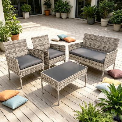 China Four Pieces Patio PE Rattan Wicker Furniture Set Outdoor Garden Conversation Sofa Set with Gray Cushions Glass Top Coffee Table for sale