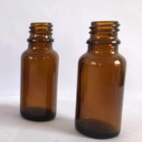 China Hot Stamping Medicine Molded Glass Vial 20ml Amber Essential Oil Glass Dropper Bottle for sale