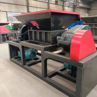 China Waste Tyre Crusher Shredder Machine 50-150mm Output with 75Kw×2 Power and Low RPM for Rubber Recycling for sale