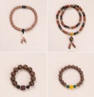 China Styrax Scent Wooden Prayer Bracelet Pain Relief Red Wood Bead Bracelet for sale