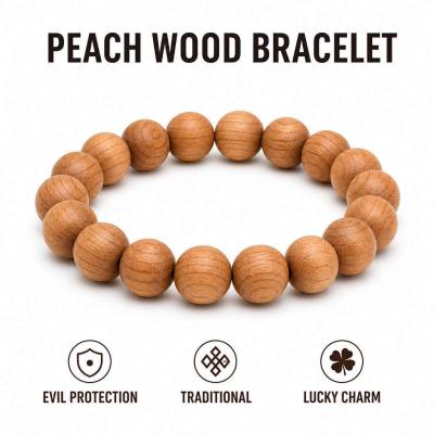 China Handcrafted Natural Peach Wood Taoist Bracelet with 14 Beads for Evil Protection and Luck for sale