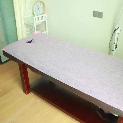 China Pp Spun Bond Waterproof Disposable Bed Sheet Roll With Cross Whole for sale