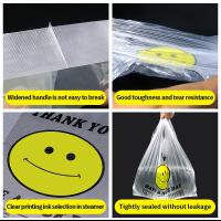 China Customizable PE Shopping Bag T Shirt Grocery Bags With Cheerful Smiley Face Design for sale