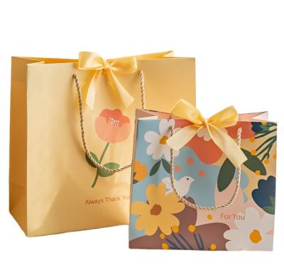 China Custom Logo Packaging Gift Carry Boutique Shopping Cardboard Paper Bags for sale