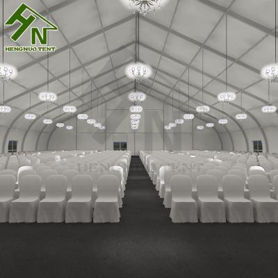 China 30x100m Curved Event Tent TFS Sandwich Panel Wall Giant Exhibition Hall for sale