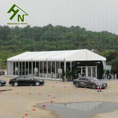 China Cutomized Hard Glass Wall Waterproof Fabric Tent 18 Degree Pitch 30m Long for sale