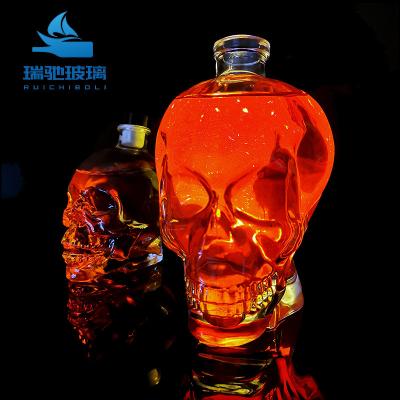 China 380ml 500ml 700ml 1000ml Skull Shape Glass Liquor Bottle with Cork and Transparent Body for sale