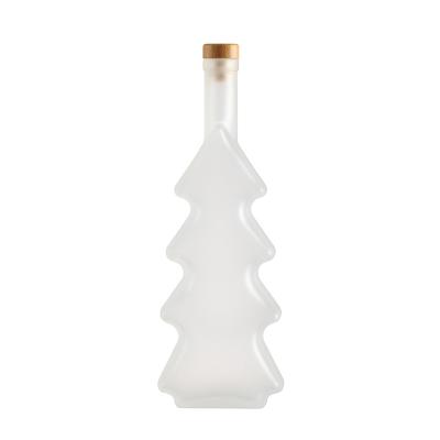China 500ml Christmas Tree Shape Frosted Glass Bottles for Wine Vodka Beverage and Design for sale