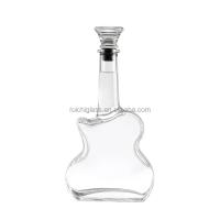 China 750ml Guitar Shaped Glass Bottles for Party Bar Super Flint Glass Vodka Wine Bottles for sale