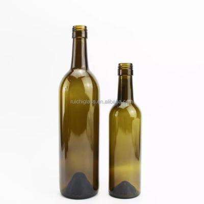 China Surface Handling Hot Stamping Customized Logo 500ml 750ml Wine Liquor Glass Bottle for sale