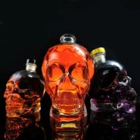 China Customize Skull Shape Hot Stamping Screen Printing 750ml Glass Liquor Bottle with Lid for sale