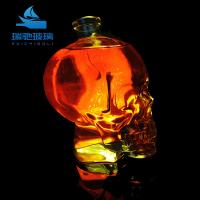 China Customize Skull Shape Hot Stamping Screen Printing 750ml Glass Liquor Bottle with Lid for sale