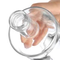 China Super Flint Glass Round Empty Liquor Wine Whisky Vodka Tequila Bottle with Cork Lid for sale