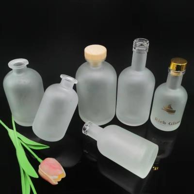 China 500ml Frosted Clear Empty Alcohol Liquor Glass Bottle with Aluminum Plastic PP Collar for sale