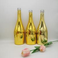 China Eco-Friendly 750ml Sparkling Liquor Glass Bottle with Electroplating Gold Color and Cork for sale