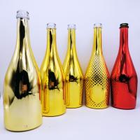 China Eco-Friendly 750ml Sparkling Liquor Glass Bottle with Electroplating Gold Color and Cork for sale