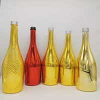 China Eco-Friendly 750ml Sparkling Liquor Glass Bottle with Electroplating Gold Color and Cork for sale