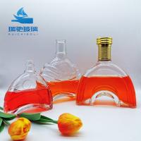 China Customized Hot Stamping 750 ml Liquor Unique Shaped Wine Glass Bottle with Cap for sale