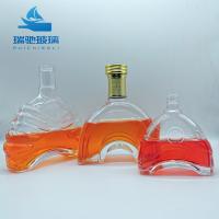China Customized Hot Stamping 750 ml Liquor Unique Shaped Wine Glass Bottle with Cap for sale