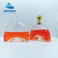 China Customized Hot Stamping 750 ml Liquor Unique Shaped Wine Glass Bottle with Cap for sale
