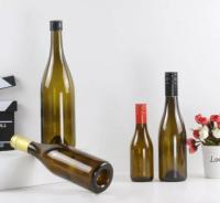 China Custom design 750 ml high white glass wine bottle with frosted finish and round shape for sale