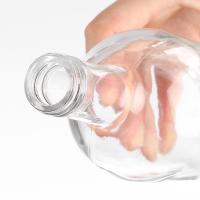 China Super Flint Glass Custom Logo Hot Stamping Vodka Brandy Liquor Beverage Wine Bottles with Cap for sale