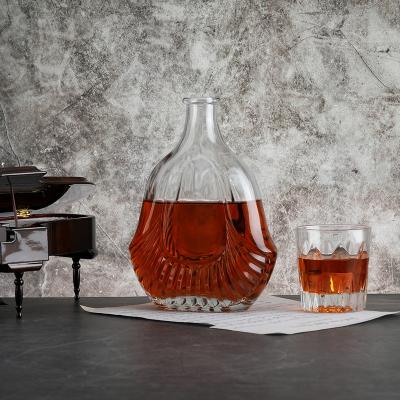 China Customize Sealing Type Super Flint Glass 750ml Square Spirit Fish Shape Liquor Bottle for sale