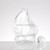 China 350ml 500ml 750ml Sailboat Shaped Glass Bottle with Cap Hot Stamped Smooth Surface for sale