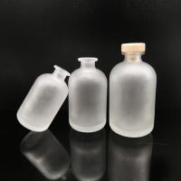 China 250ml 700ml Frosted Round Glass Bottle for Liquor Made of Super Flint Glass Material for sale