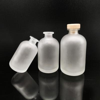 China 250ml 700ml Frosted Round Glass Bottle for Liquor Made of Super Flint Glass Material for sale