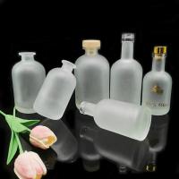 China 250ml 700ml Frosted Round Glass Bottle for Liquor Made of Super Flint Glass Material for sale