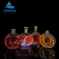 China Super Flint Glass 750ml Clear Embossed Vodka Elegant Custom Fancy Glass Liquor Bottles for sale
