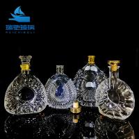 China Super Flint Glass 750ml Clear Embossed Vodka Elegant Custom Fancy Glass Liquor Bottles for sale