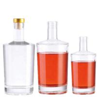 China Surface Handling Hot Stamping 700ml/750ml Glass Liquor Bottles with Screw Cap for sale