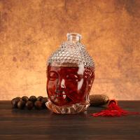 China Aluminum Plastic PP Collar 750ml Clear Glass Spirits Bottle in Unique Buddha Shape Design for sale