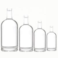 China Surface Handling Hot Stamping 700ml/750ml Glass Liquor Bottles with Screw Cap for sale