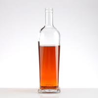 China Surface Handling Hot Stamping 700ml/750ml Glass Liquor Bottles with Screw Cap for sale
