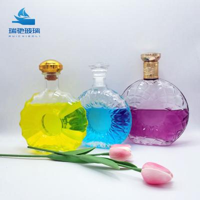 China Custom Design Bulk Empty 750ml Nordic Clear Embossed Vodka Bottle for Light Display for sale
