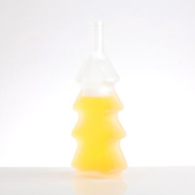 China Custom Make Christmas Tree Shaped Glass Bottle with Cork For Whisky Lovers for sale